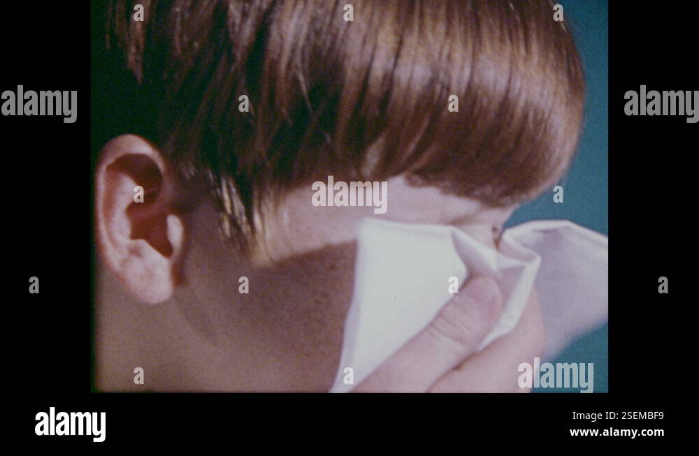 1970s: Microscopic image of germs. Boy sneezes. Titles. Microscopic ...