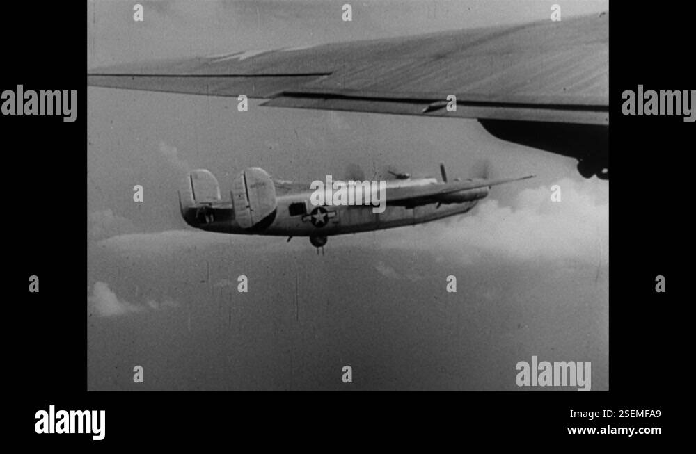 1940s: Plane descends in flames and explodes on ground. Bombers in sky ...