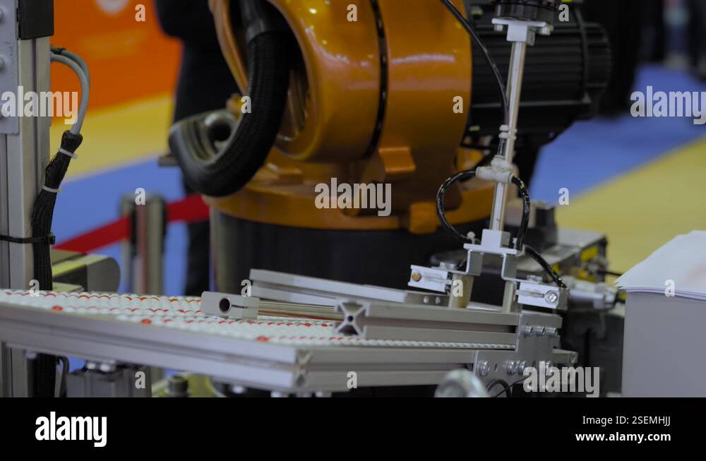 Pick and place robotic arm manipulator moving plastic detail at exhibition Stock Video Footage ...