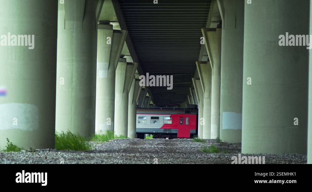 a train or electric train is sweeping past under the bridge. linear ...