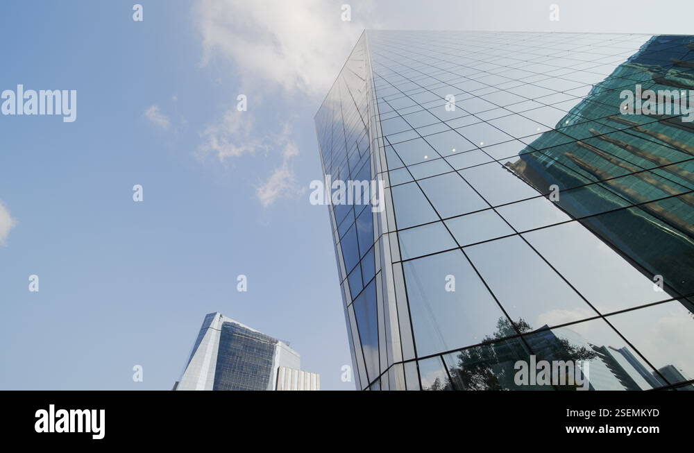 Low wide angle of glass business building of blue mirrors on the ...