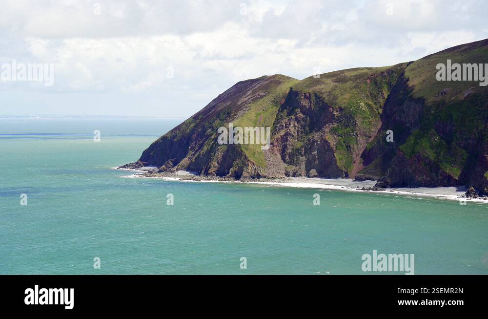 View of the rocky cliffs and headland at the end of Lynmouth Bay from ...