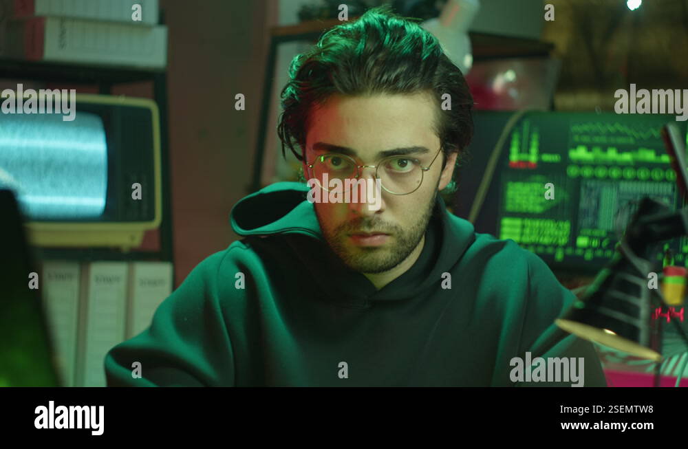 Hacker entering room and putting on glasses, typing on keyboard ...