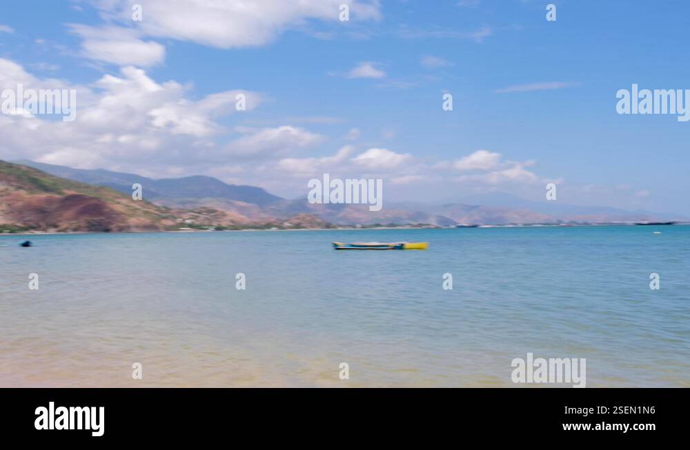 White beach on idyllic scenic coastline of remote tropical Timor Leste ...