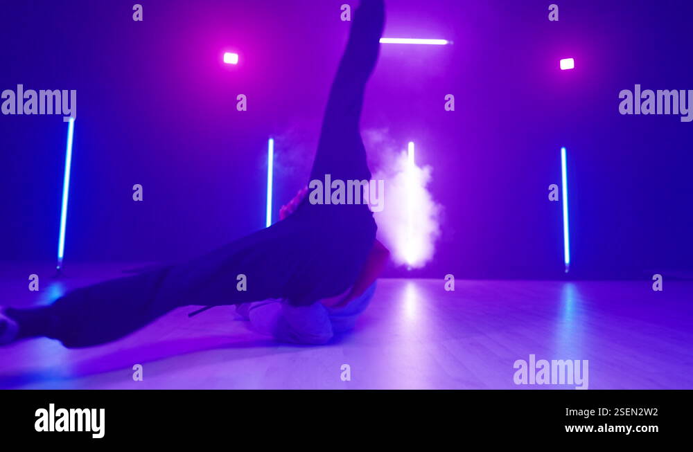 Neon lights dancer spin on head breakdancing in slow motion 4K Stock ...