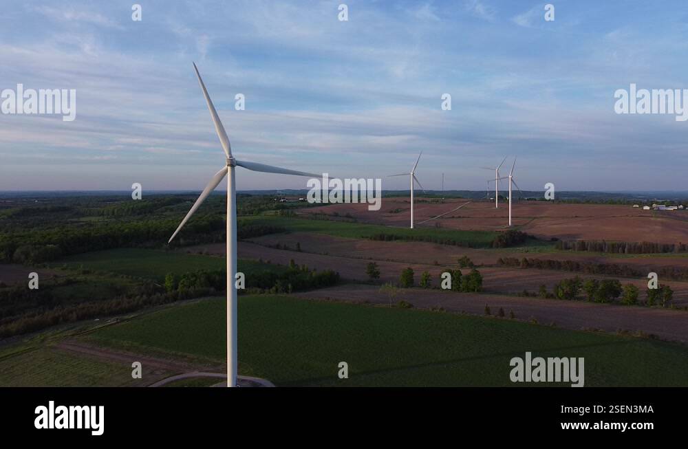 Aerial of renewable sustainable energy wind turbine farms on fields; 4k ...