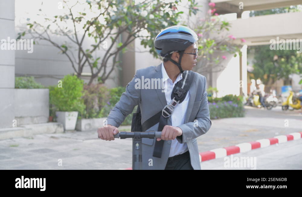 Energy efficient travel vehicle concept of 4k Resolution. An Asian man pushin Stock Video ...