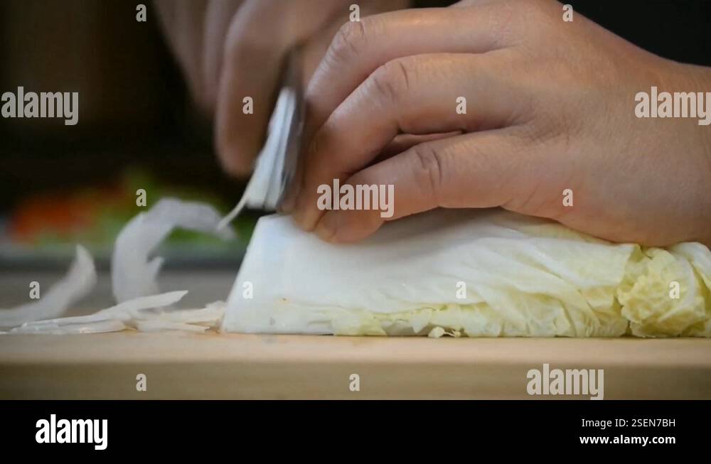 Man's hand chopping cabbage with knife in Kitchen Stock Video Footage ...