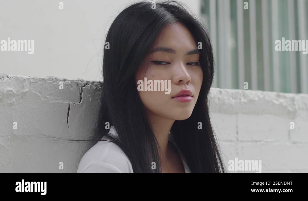 Portrait of beautiful asian woman with dark long Stock Video Footage ...