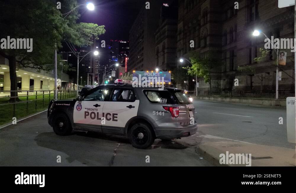 Police vehicle blocking city street at accident area where police ...