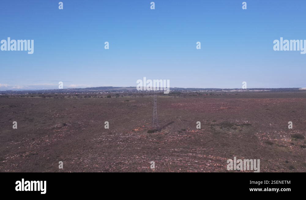 Drone flying towards electric pylon in open field Stock Video Footage ...