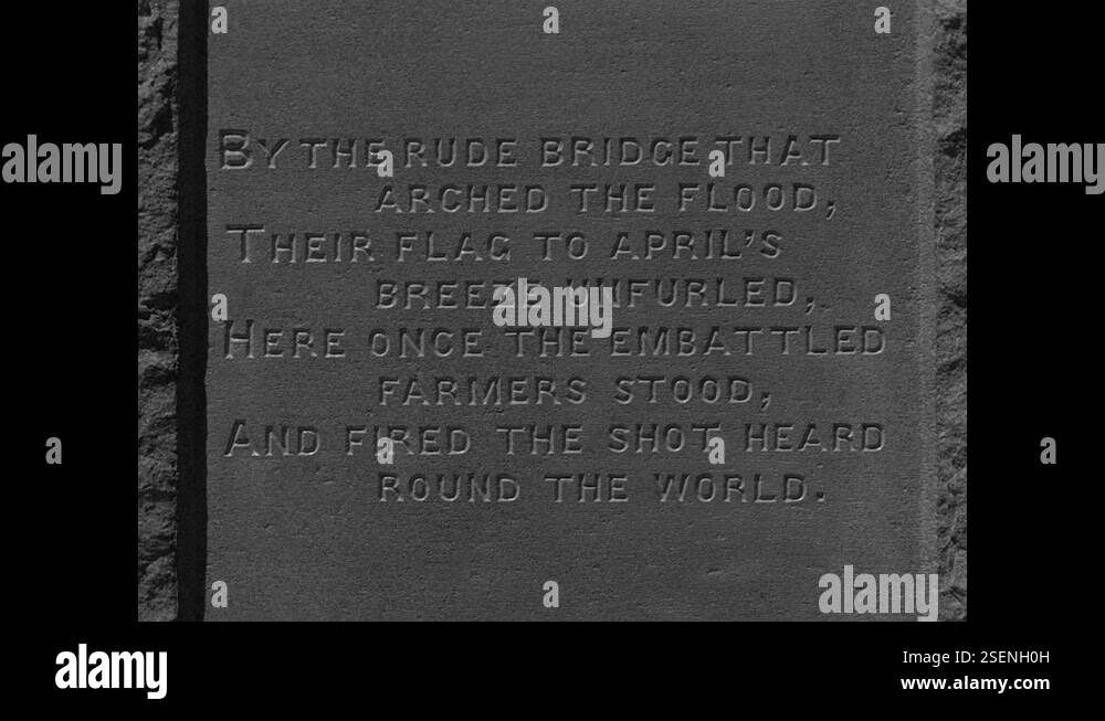 1950s: Inscription on monument. Man and woman look at inscription ...