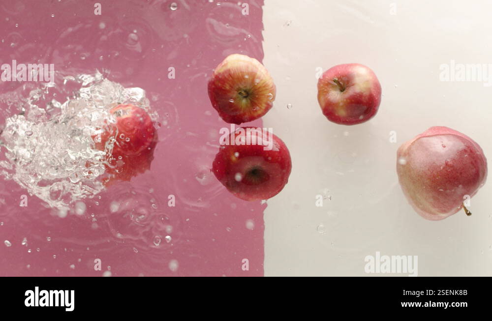 sweet apple filmed from top fly in aquarium for commercial juice beaty ...