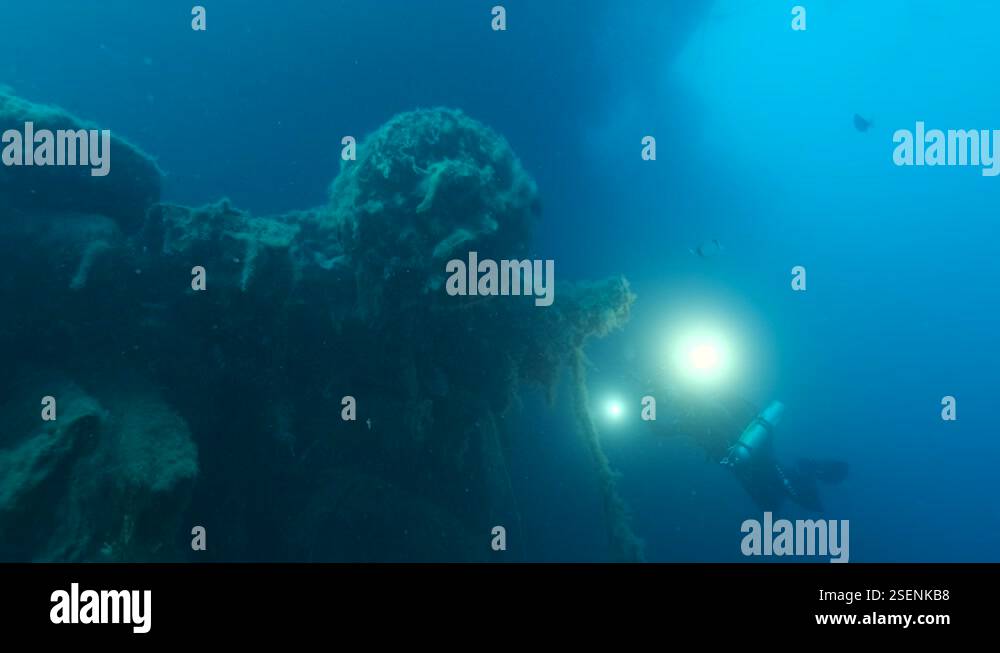 Cameraman takesshots the car on shipwreck Swedish ferry MS Zenobia ...