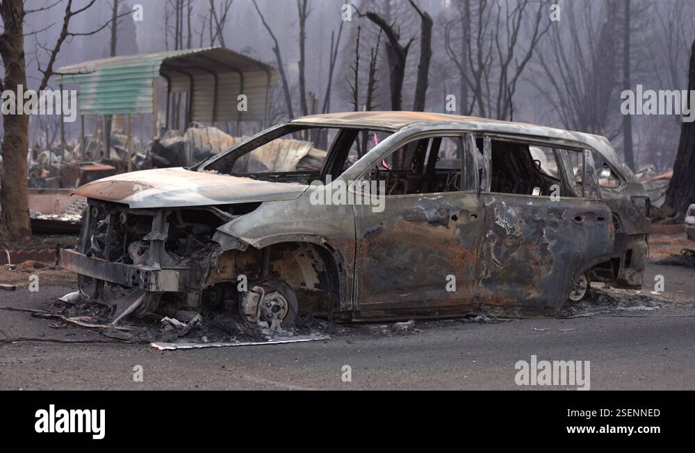 Burned Vehicle after Wildfire tears through town Stock Video Footage ...