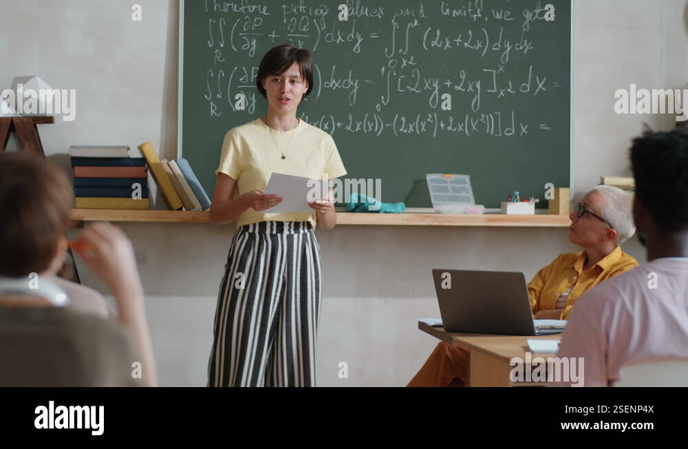 Female Student Reciting Lesson in front of Classmates and Teacher Stock ...