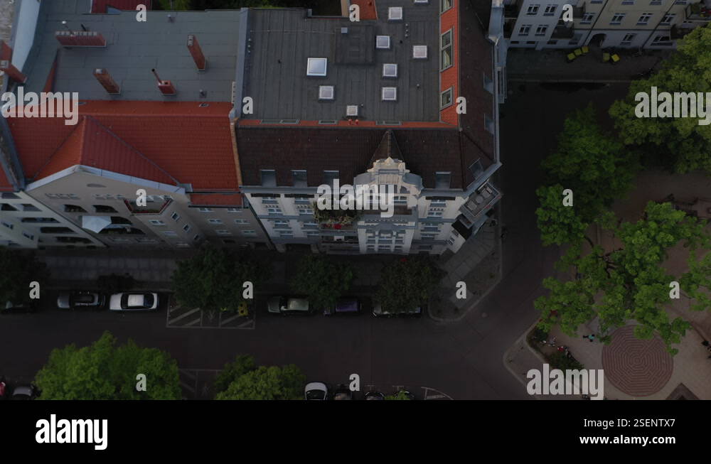 Aerial birds eye overhead top down ascending view of multi storey ...