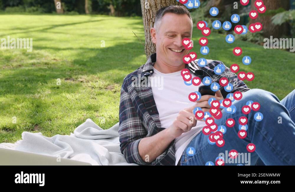 Animation of falling social media icons over man using smartphone Stock ...