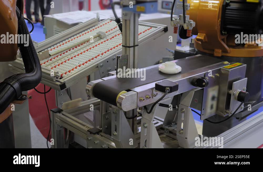 Pick and place robotic arm manipulator moving plastic detail on ...