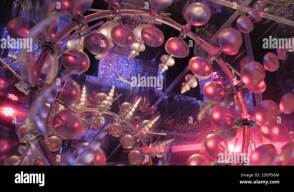 Moving parts of mechanical contemporary art installation with colorful ...