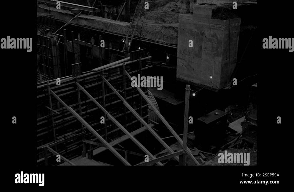 1960s: Workers in a trench, welding retaining walls. Construction ...