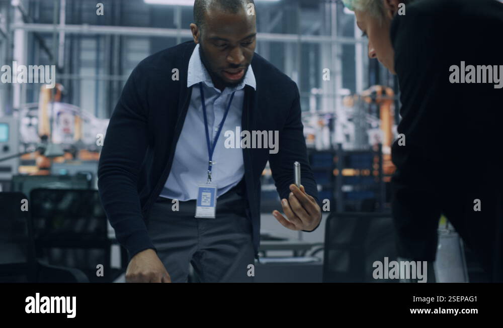 Two Engineers Working on Concept Parts for Electric Car Motor Stock ...