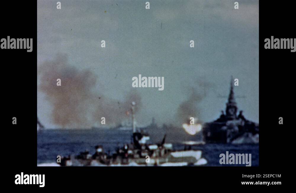 1950s: Battleship at sea fires cannon. Cannons fire on battleship ...