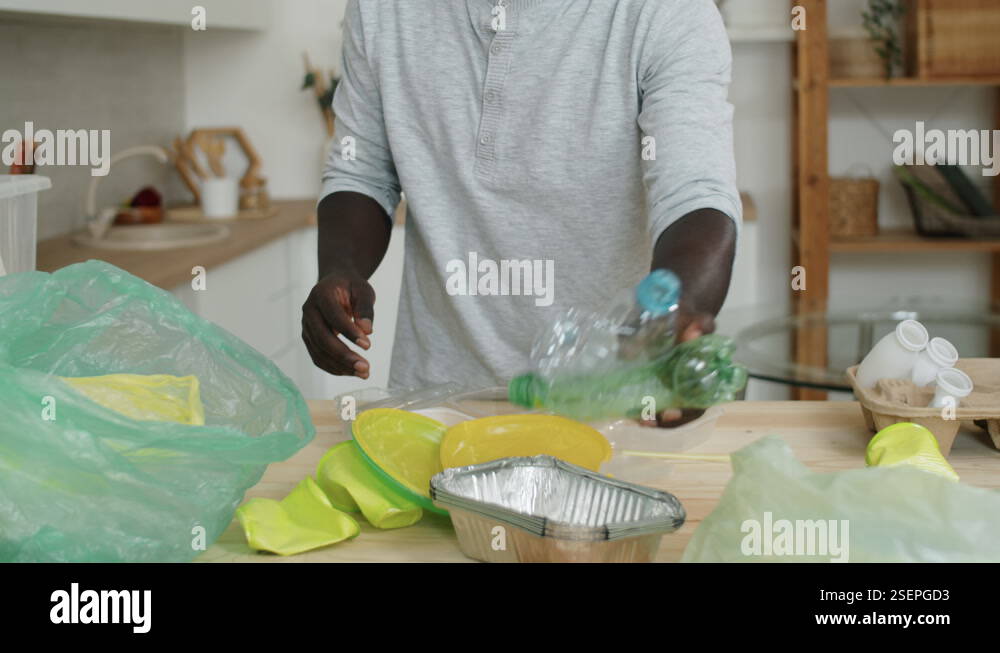 Close Up of Afro Man Sorting Waste for Recycling at Home Stock Video ...