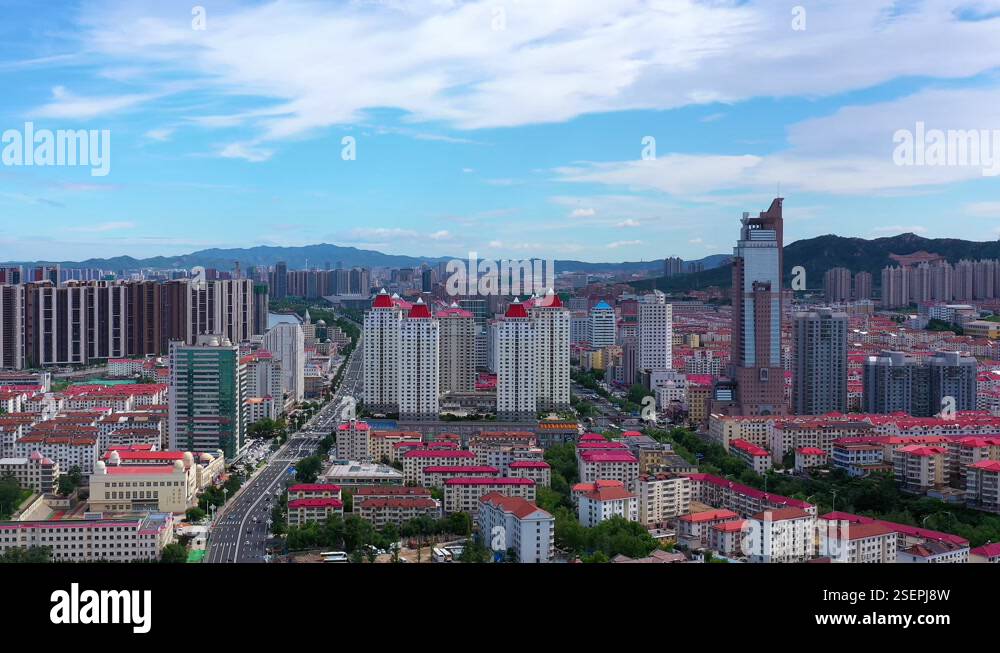Time-lapse view of tall buildings and roads in a prosperous city in ...