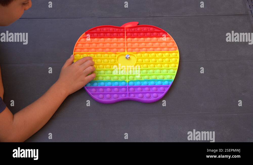 two kids playing with pop it Stock Video Footage - Alamy