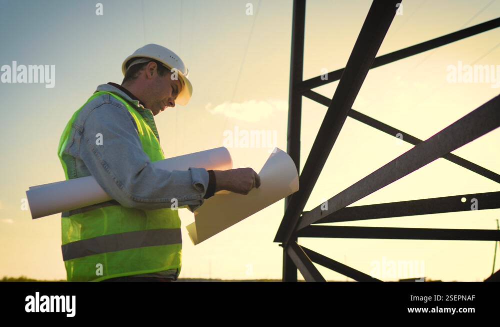 Architect Worker Checking Construction Project On Electric Tower. One ...