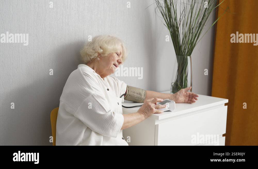 Everyday health check-up. Senior lady with hypertension measuring blood ...