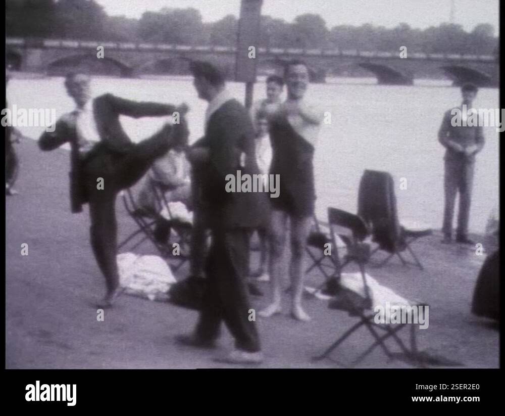 Man speaking about swimming while people jumping in river from diving ...