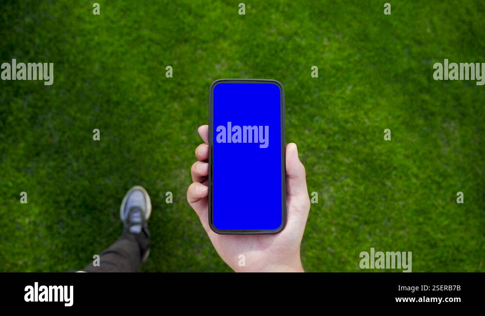 Person Hold Smartphone with Green Screen Chroma Key and Talking of ...