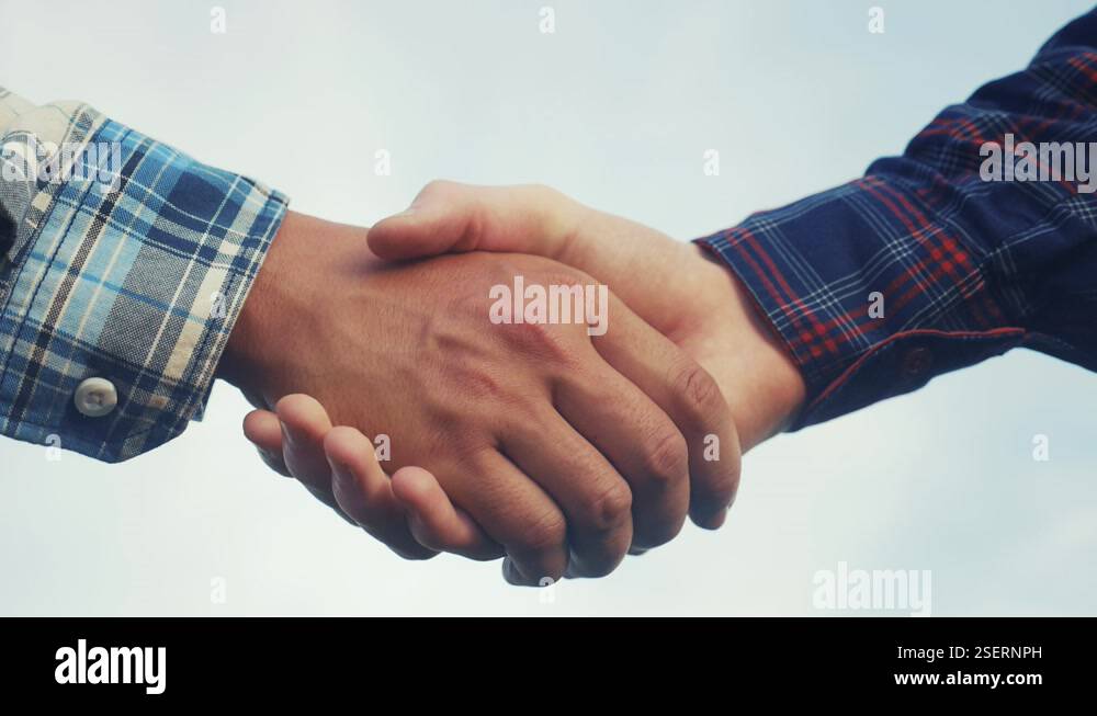teamwork handshake concept. two people shake hands shaking hands ...