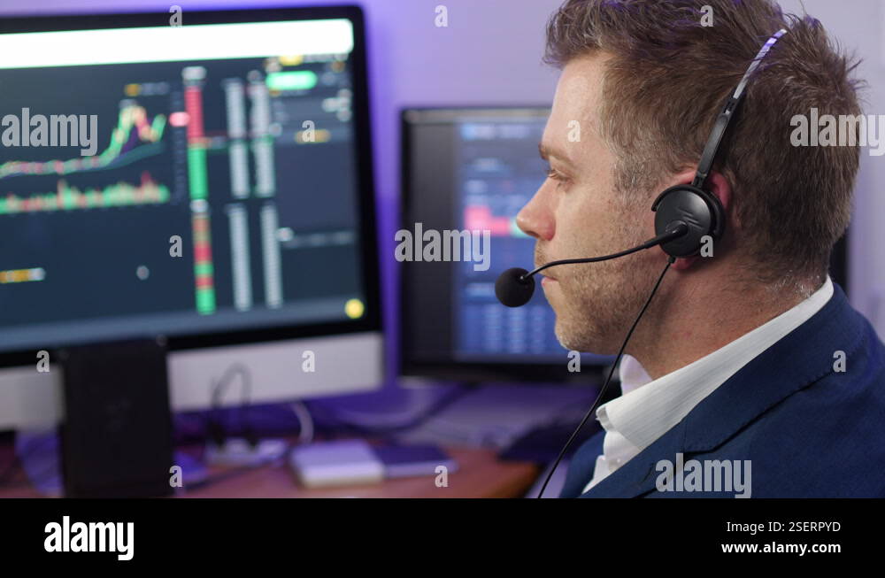 Nodding man in business clothing working in technical support at a ...