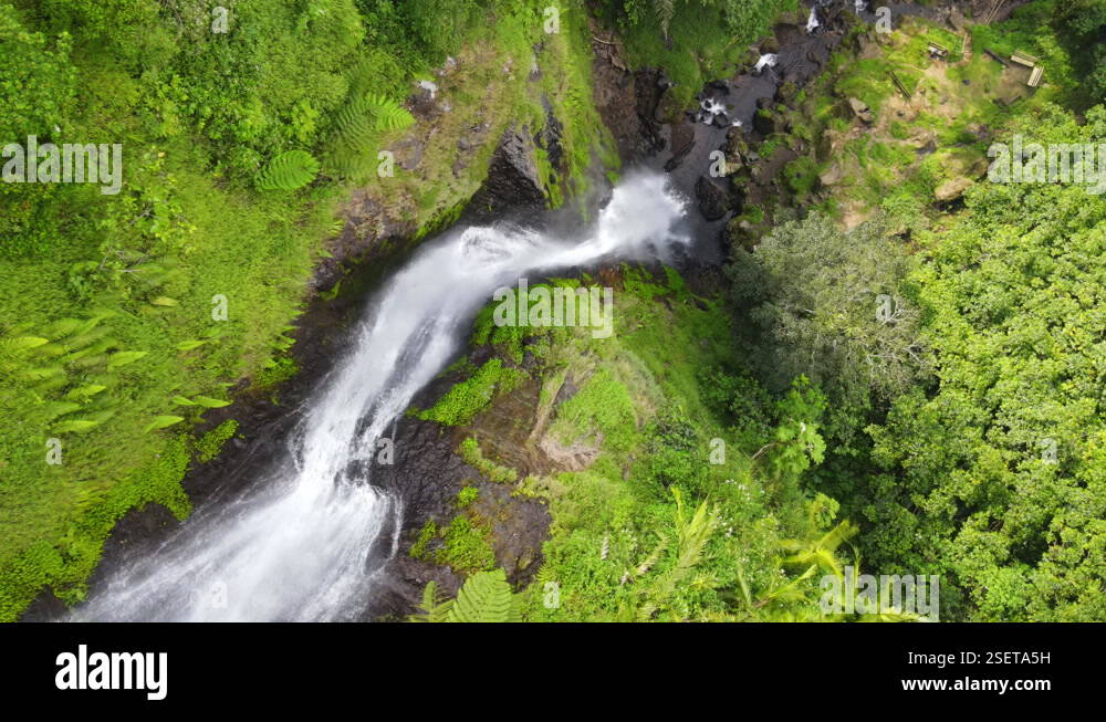 Epic top down view of a high waterfall in a tropical forest in Java ...