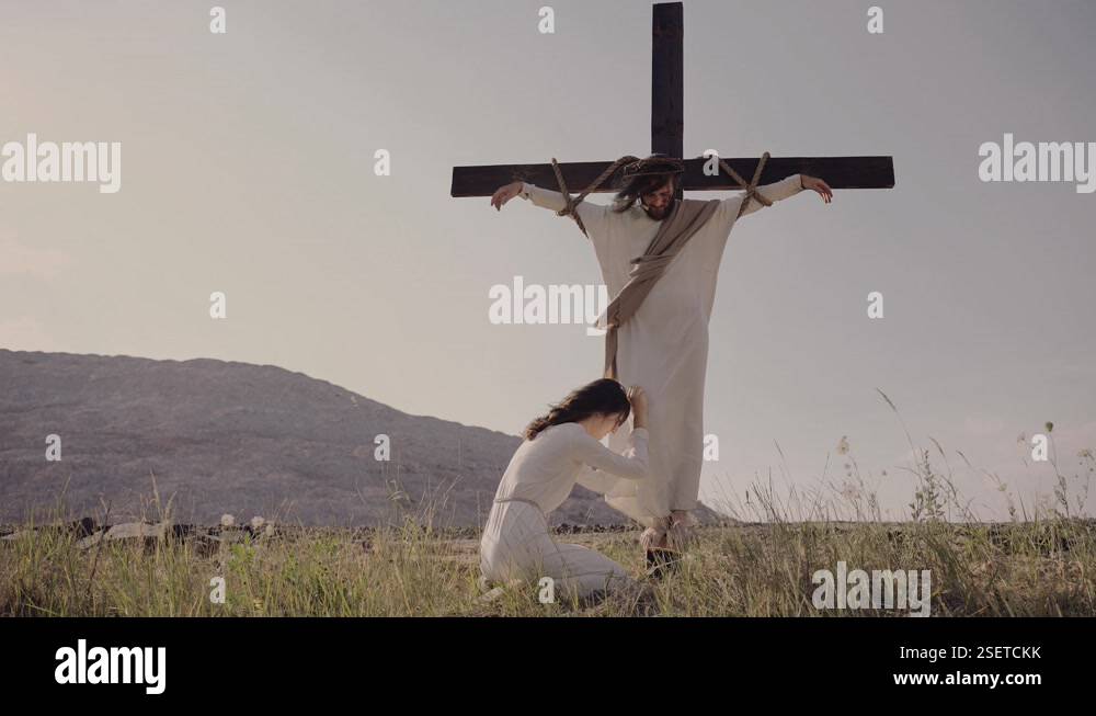 Mary mourns the death of Jesus at his feet. Jesus is crucified on the cross Stock Video Footage ...