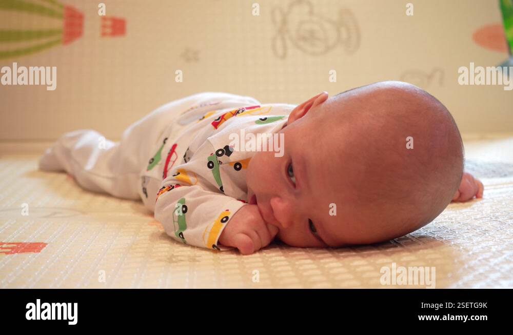 Baby learn head control, 2 month old baby boy lifting head lying on ...