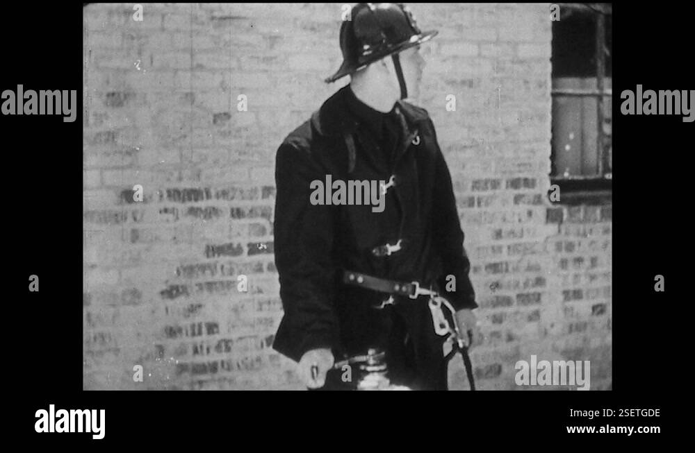 1940s: Firefighter attaches adaptor to fire hydrant then turns hydrant ...