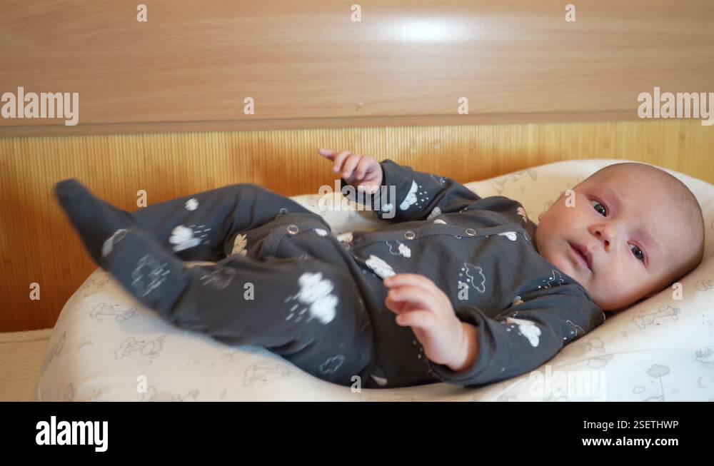 Baby boy lying in baby pod newborn cocoon Stock Video Footage - Alamy