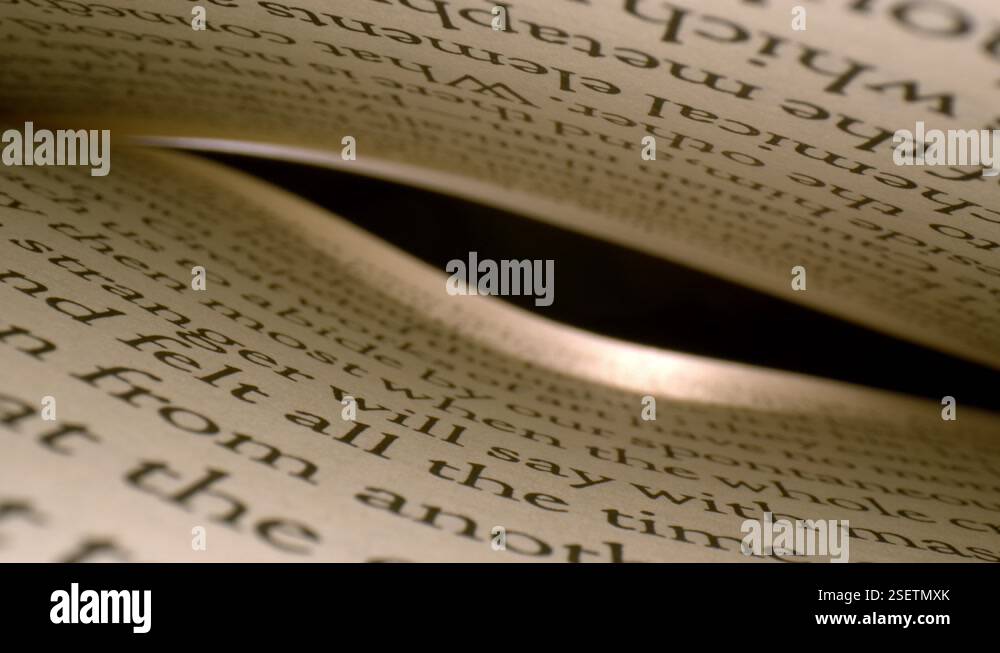 Starting deep inside a book as the pages are open and slightly curved ...