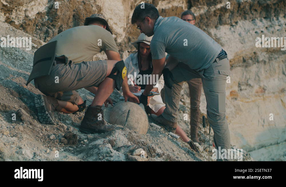 Team of archaeologists excavating amphora Stock Video Footage - Alamy