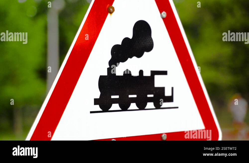 Railroad Crossing without barrier ahead traffic sign in Europe, close ...