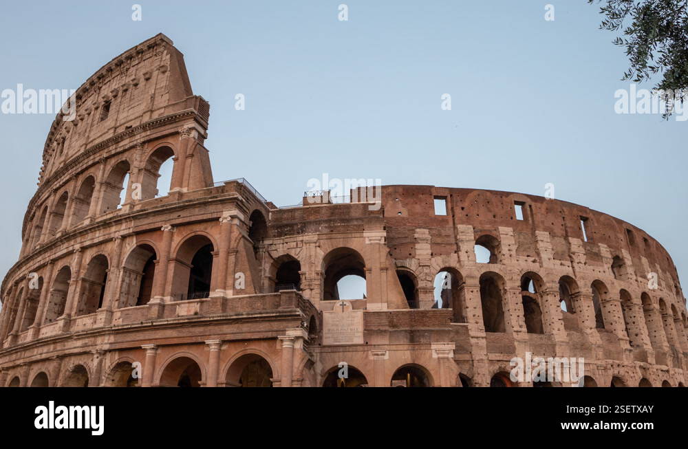 zoom out timelapse showing transition from day to night at Colosseum ...