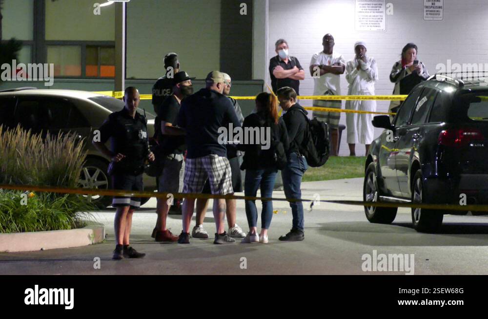 Witnesses Talking With The Police At The Scene Of A Shooting Crime ...