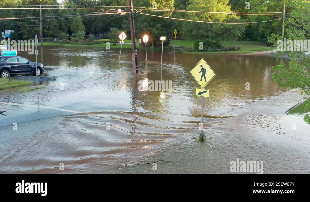 Pedestrian crossing crosswalk under flood water. Heavy rain hurricane ...