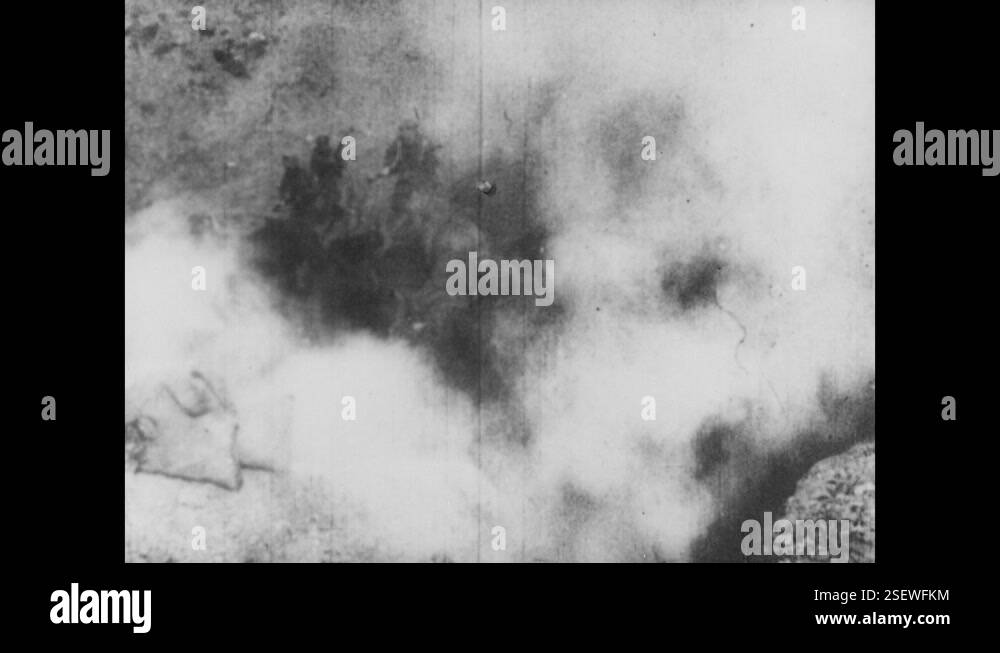 1910s: Battlefield. Soldiers in trenches. Explosions. Dirt flies. Man ...