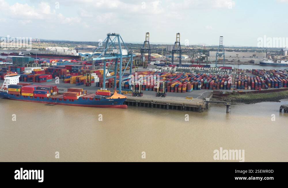 Freight harbour with ship and stacked rows of naval containers Stock ...