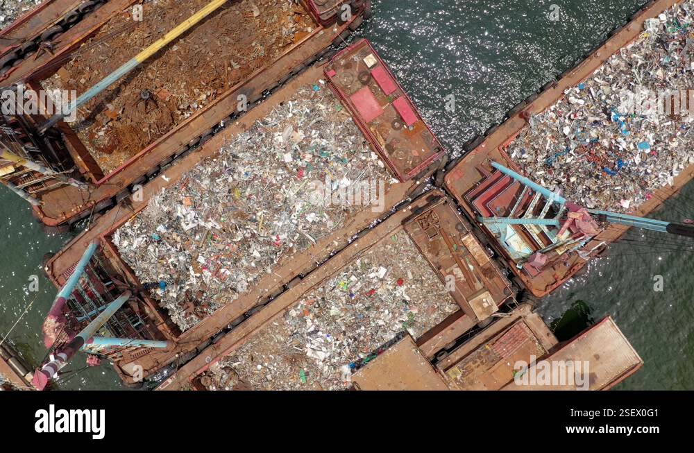 Recycling scrap metal plant over crane load a cargo ship vessel Stock ...